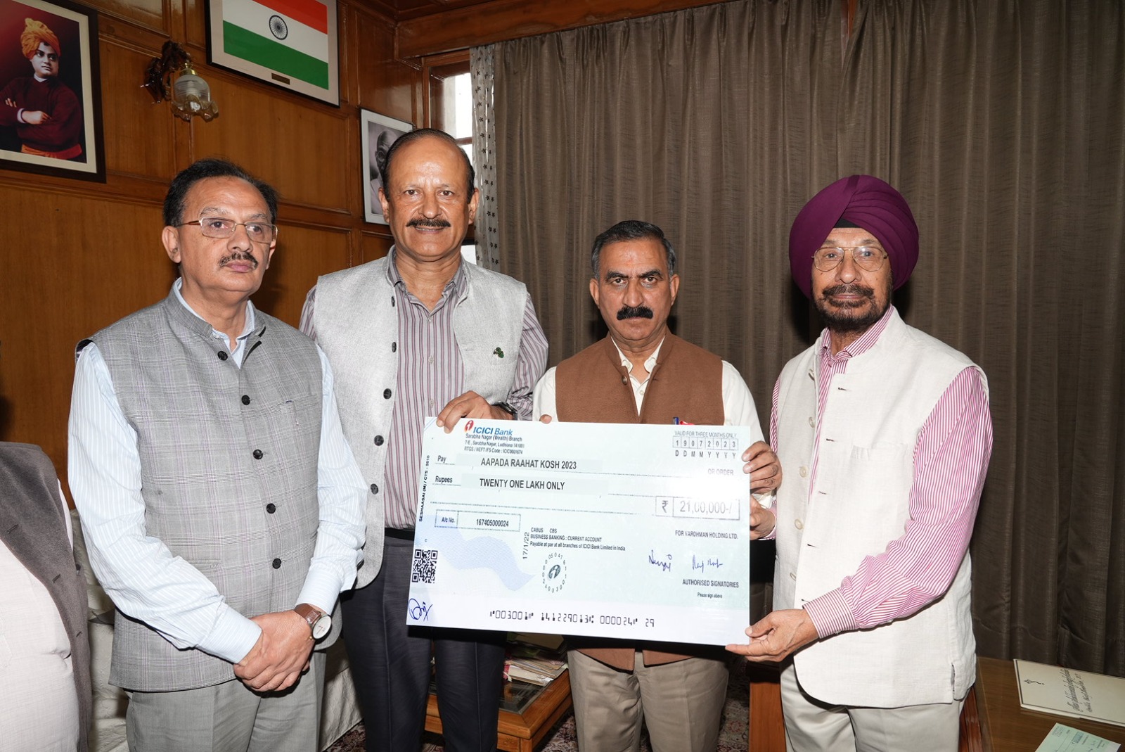 A cheque of Rupees Twenty One Lakh was presented A cheque of Rupees ...